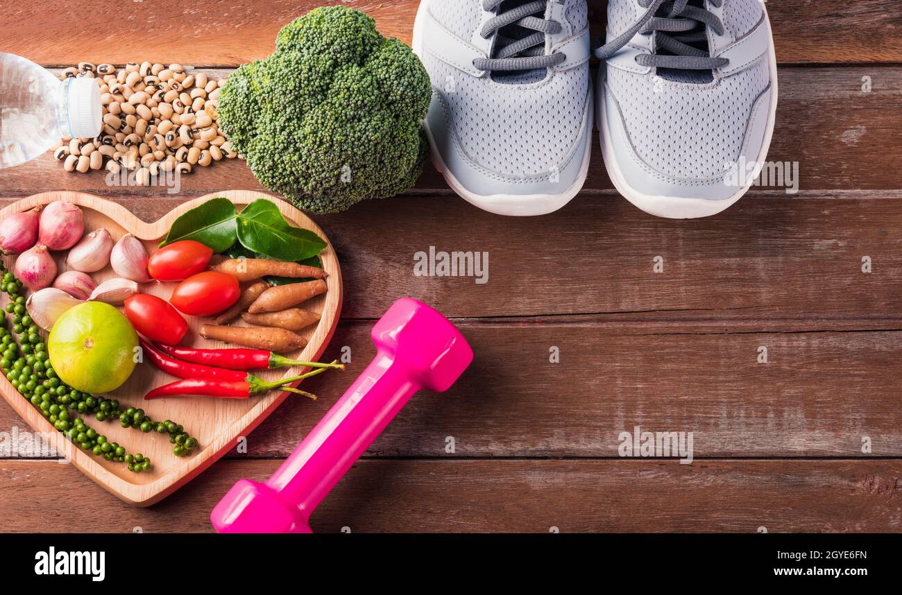 Top view of various fresh organic fruit and vegetable in heart plate ...