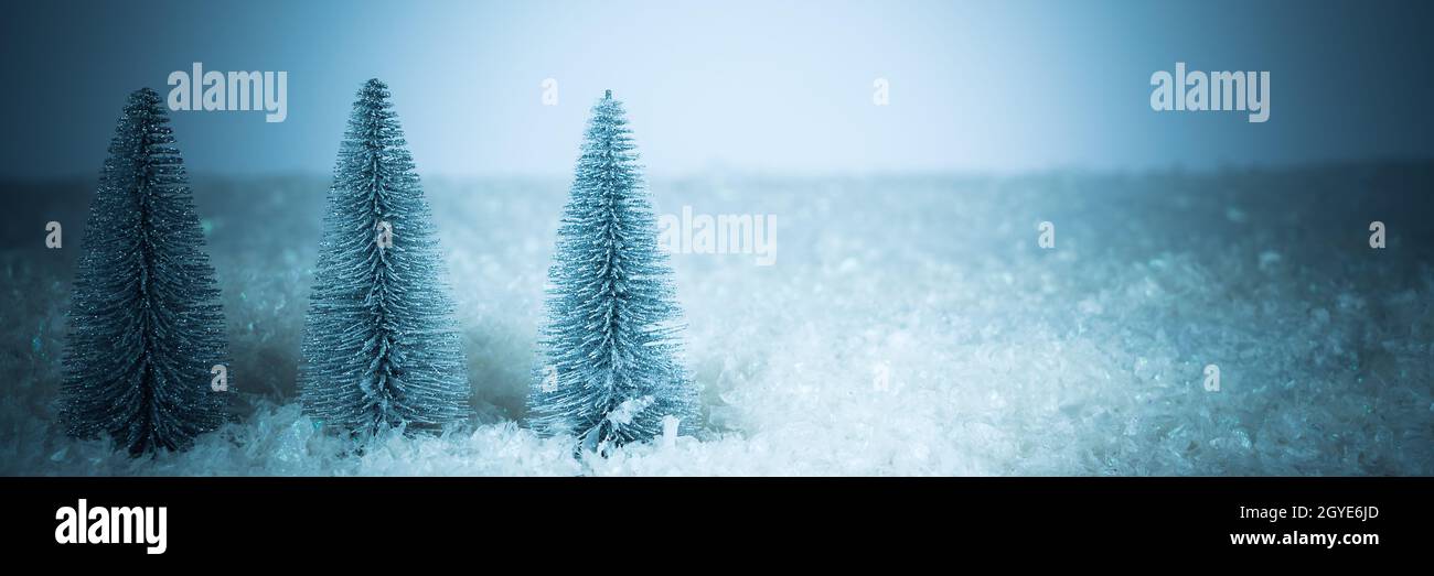 Three fir trees in the snow, banner with copy space Stock Photo - Alamy