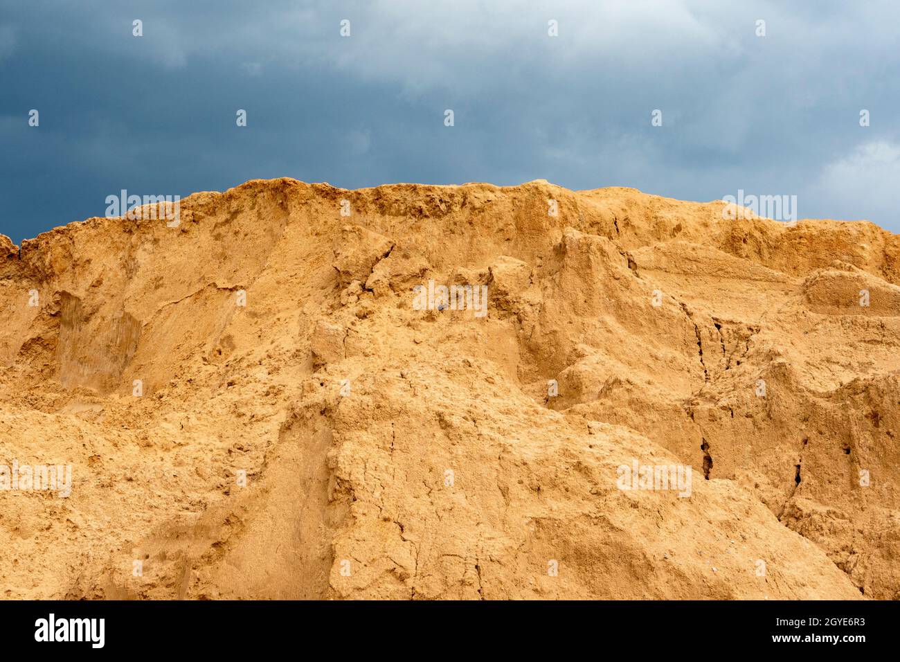 Open pit sand mining. Large pile of construction sand used for asphalt ...