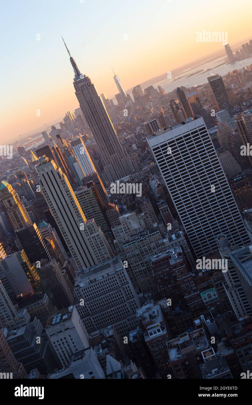 Golden sunset panoramic view of building and skyscrapers in Midtown and ...