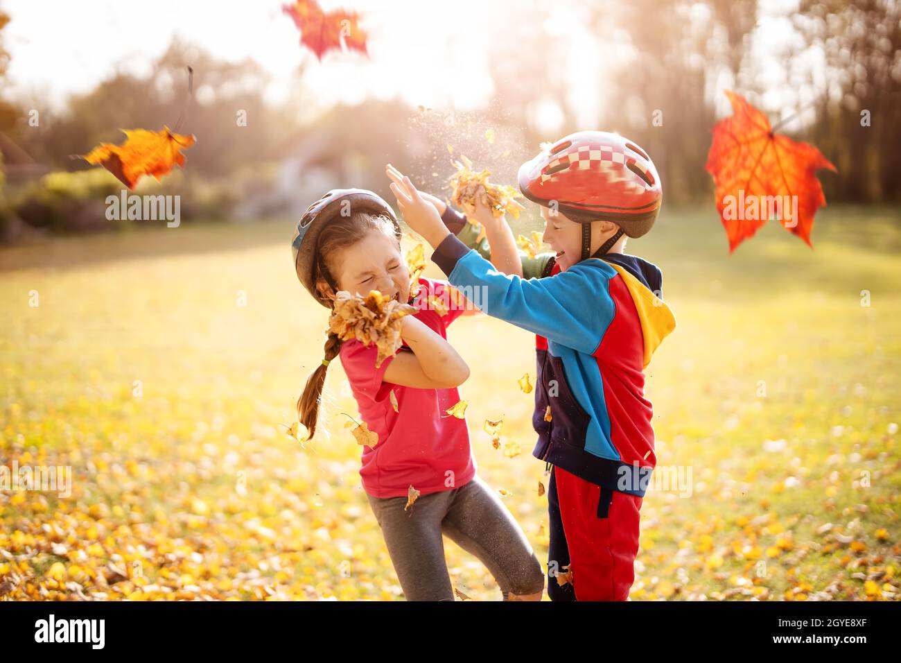 Two cute children playing together in the park. Concept of the ...