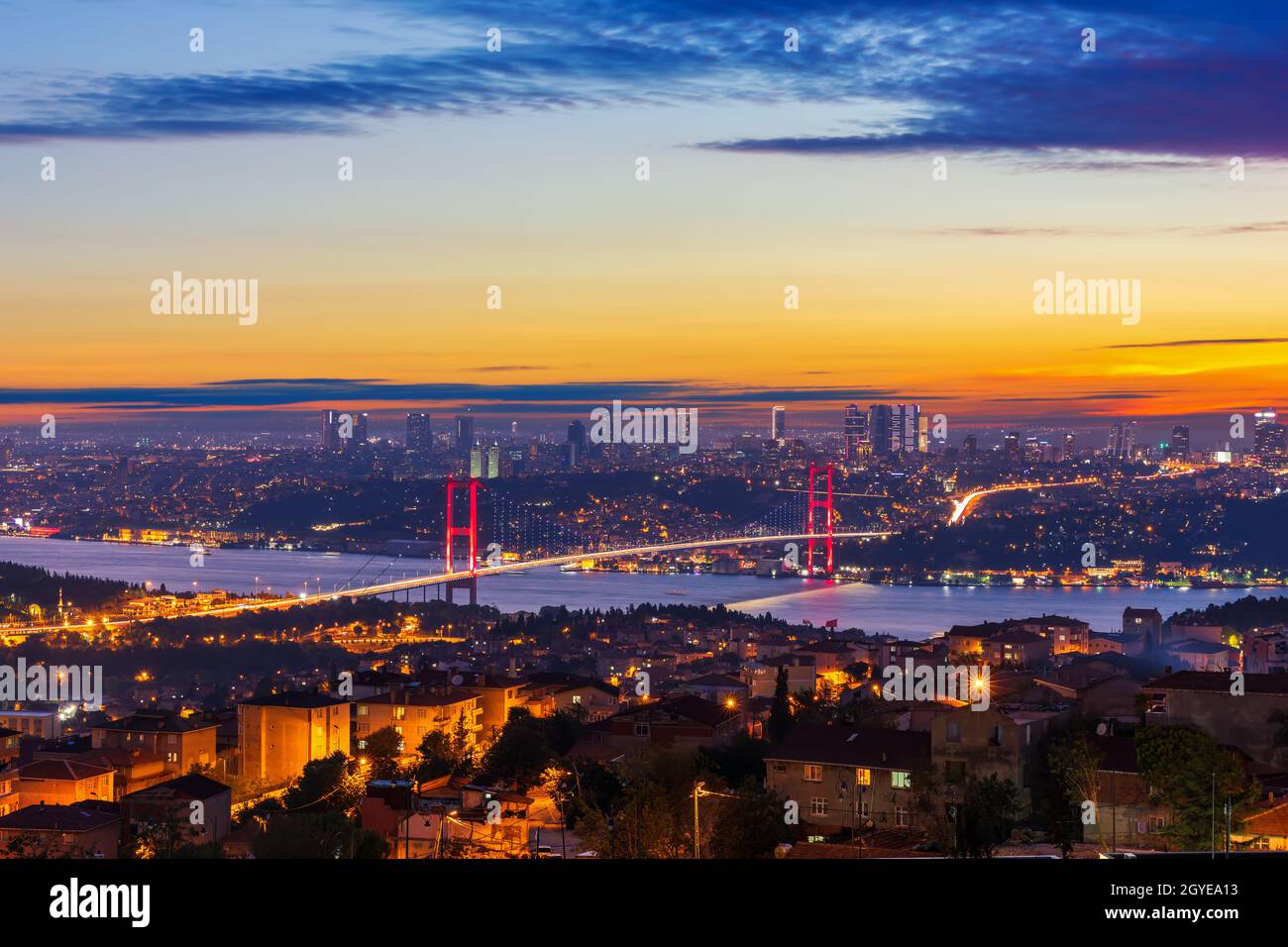 The Bosphorus bridge and the skyline of Istanbul at sunset Stock Photo ...