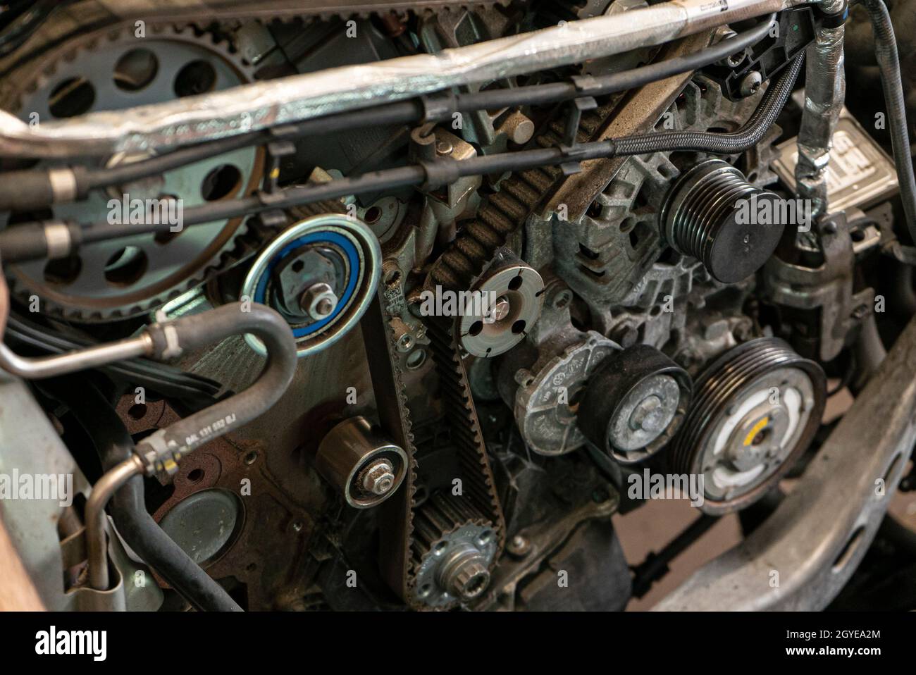 Detail of Car engine timing belt in a workshop Stock Photo - Alamy