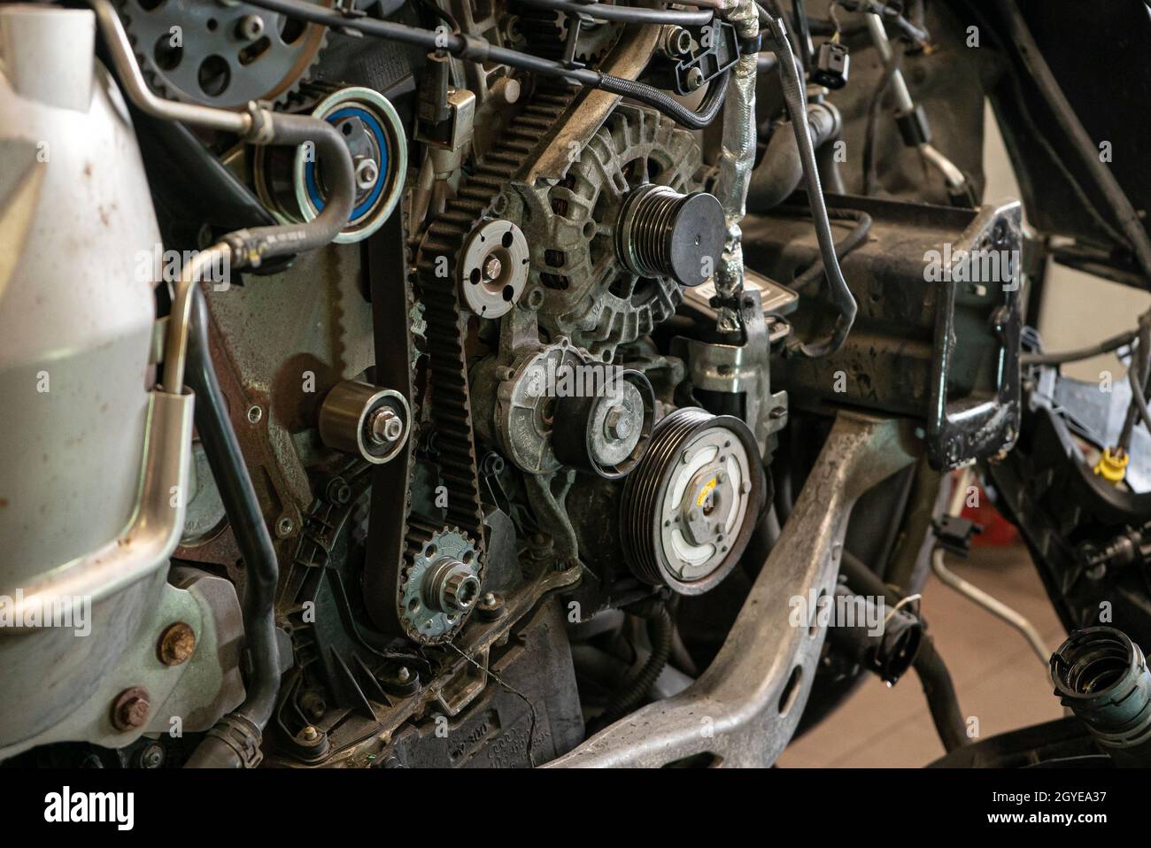 Detail of Car engine timing belt in a workshop Stock Photo - Alamy