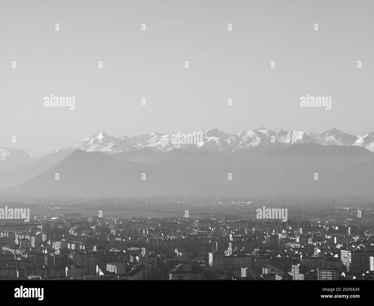 Aerial view of the city of Turin, Italy with Alps mountain range in the ...