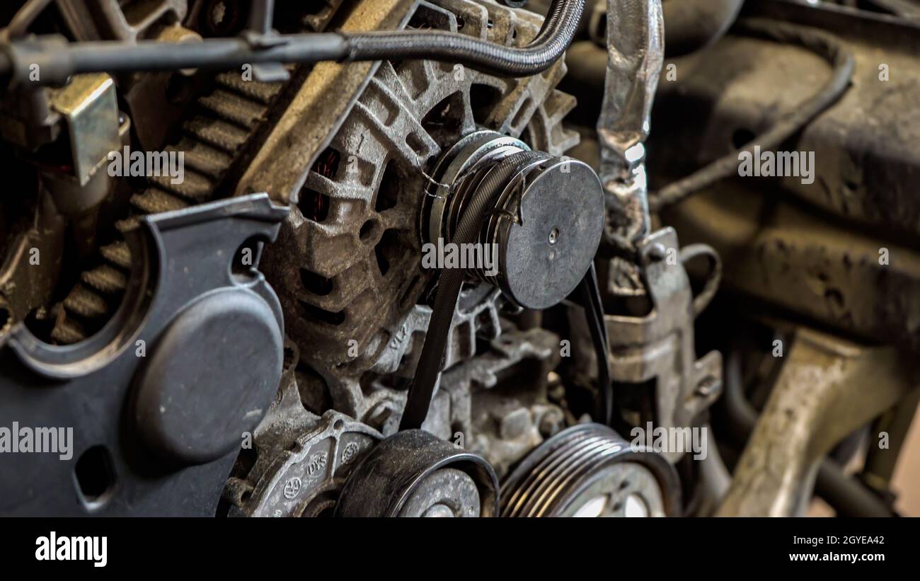 Alternator car engine detail in a workshop Stock Photo - Alamy