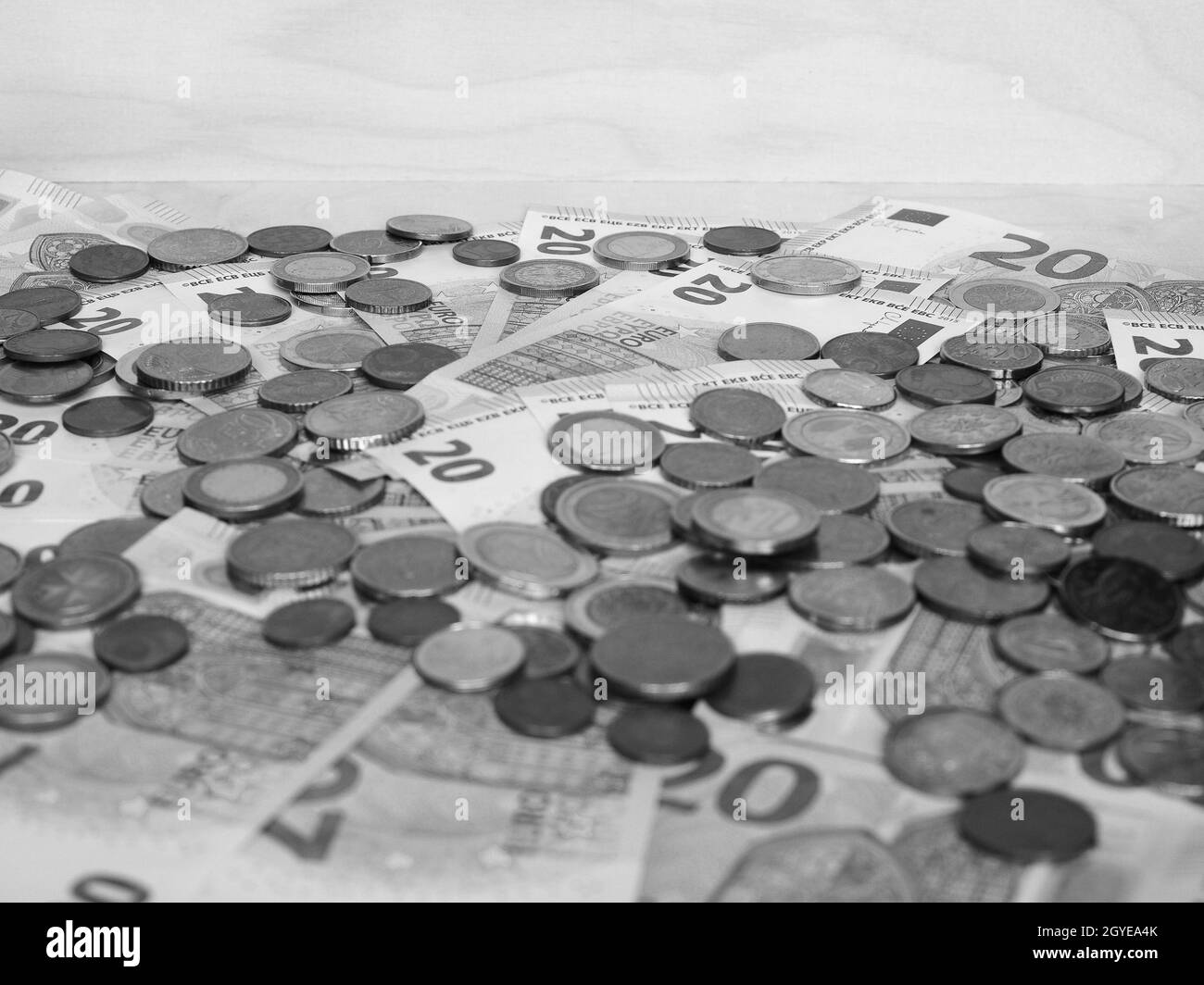 Euro banknotes and coins (EUR), currency of European Union in black and ...