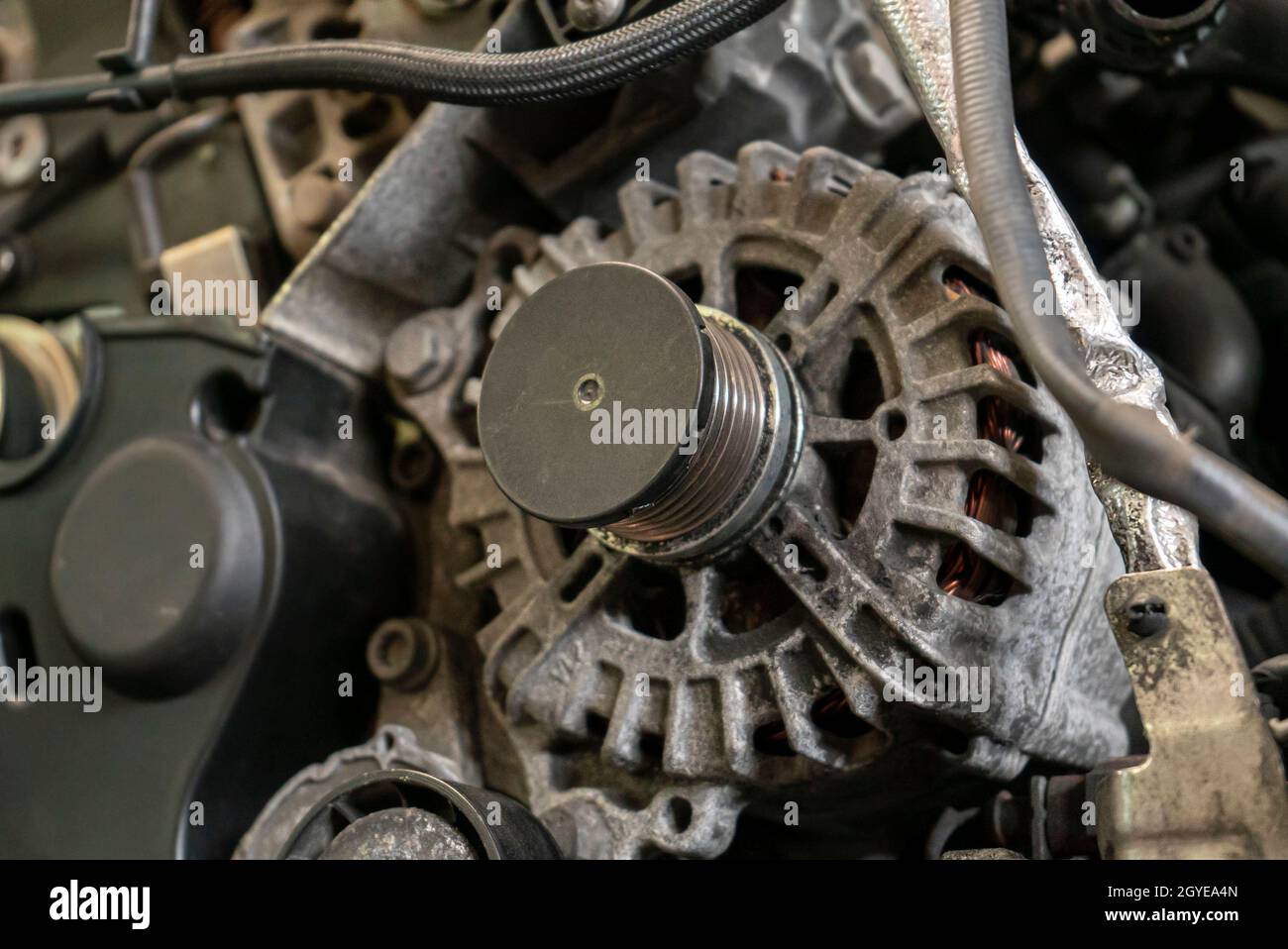 Alternator car engine detail in a workshop Stock Photo - Alamy