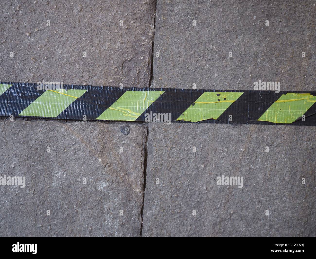 black and yellow line danger warning sign Stock Photo - Alamy