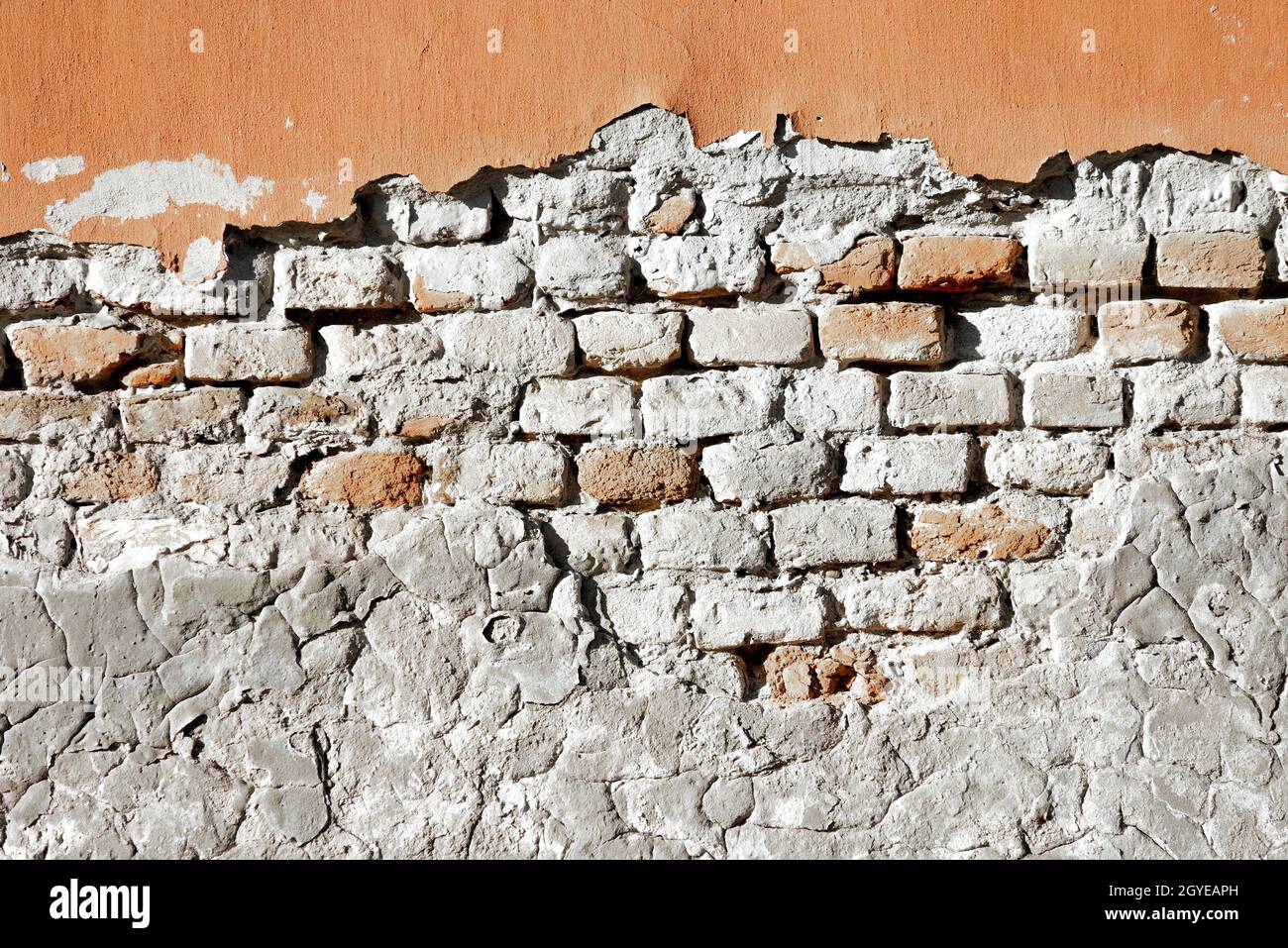 Partially damaged old brick wall texture Stock Photo - Alamy