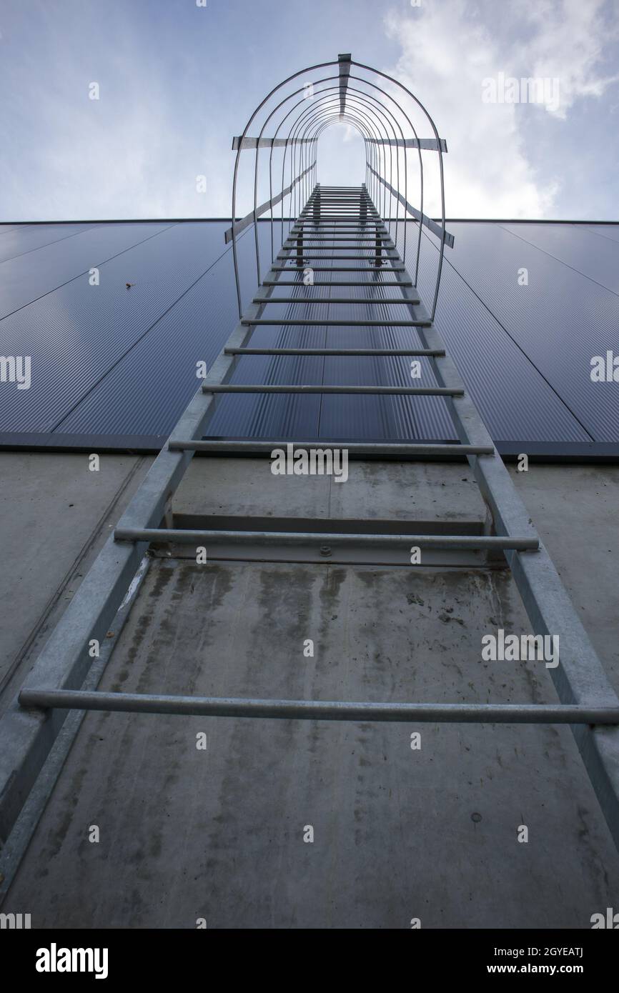 Fire escape on the industrial building above, bottom view. Stainless ...