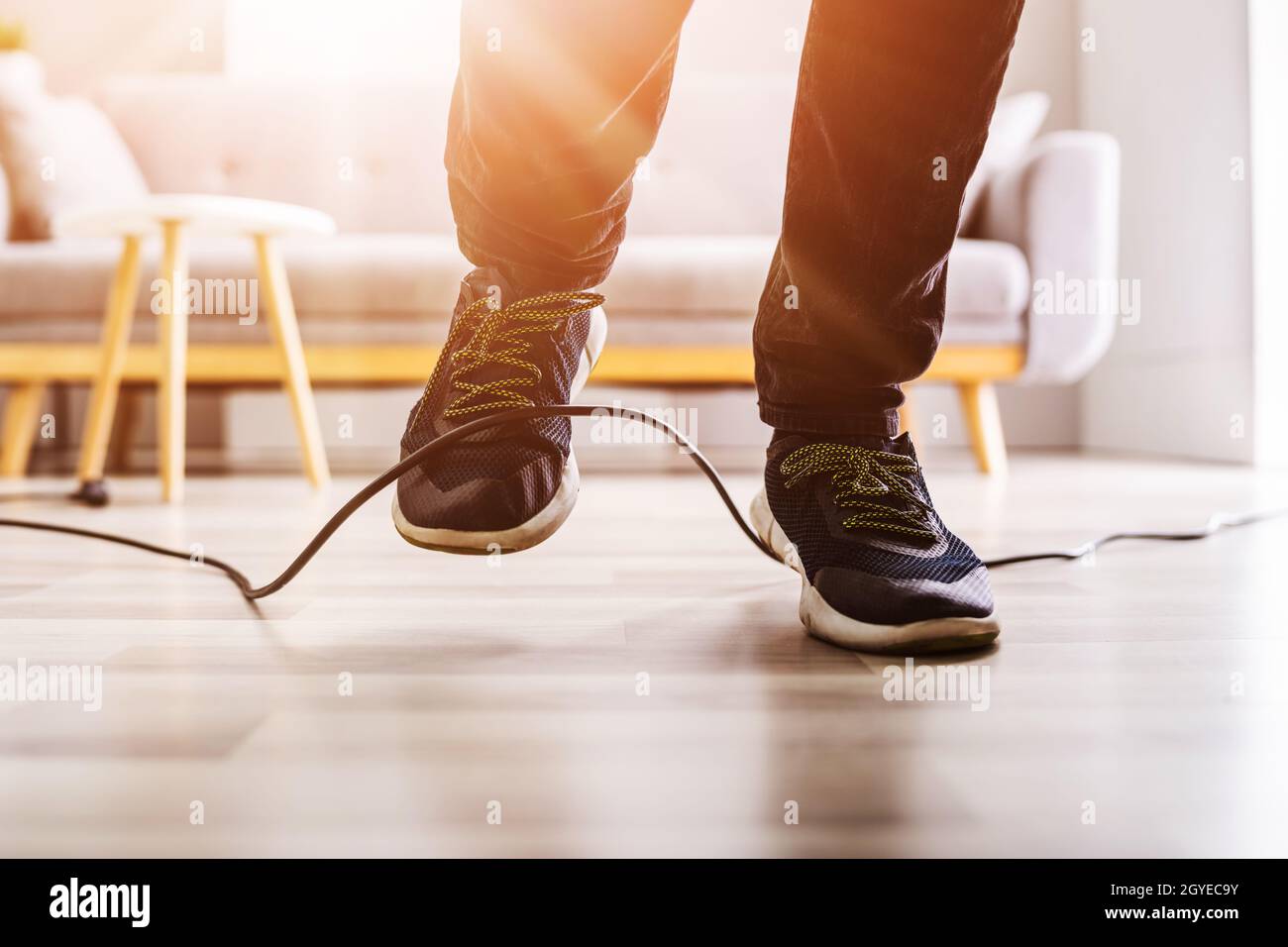 Wire Cord Trip Over And Fall. Feet Stumble On Cable Stock Photo - Alamy