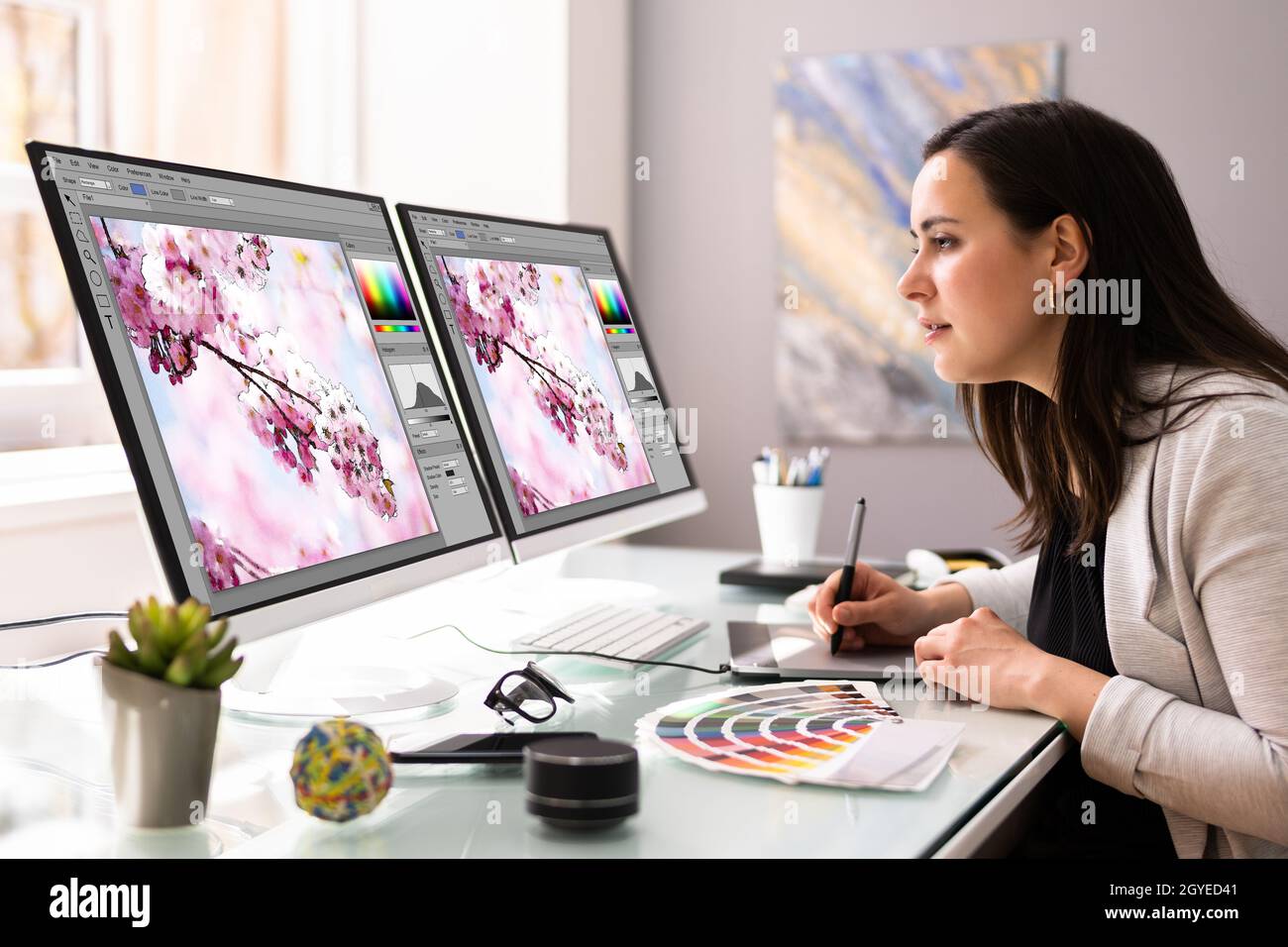Website Graphic Designer Working In Office On Multiple Screens Stock ...