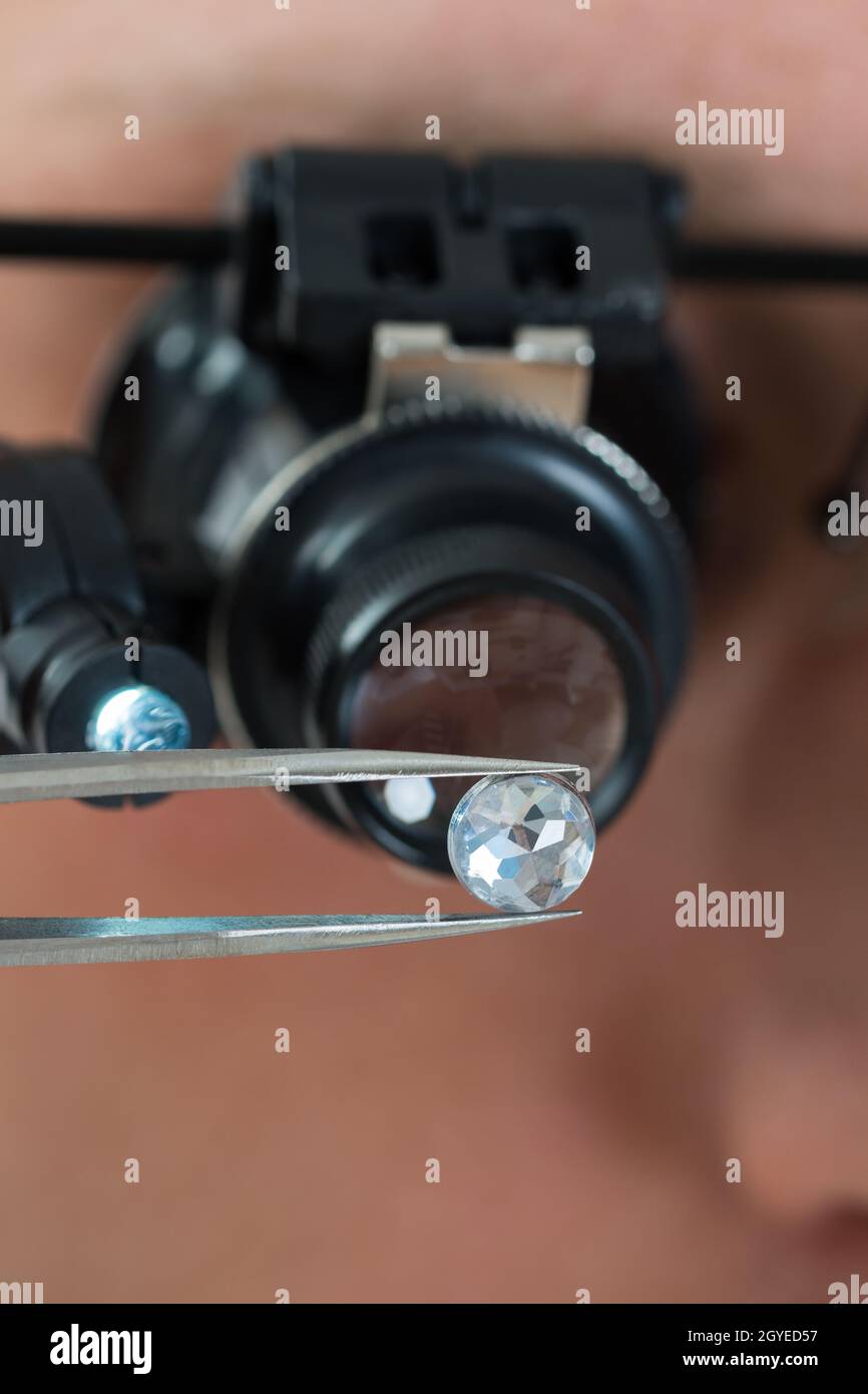 Jewelry And Diamond Repair. Jeweler Using Magnifier Loupe Tool Stock ...