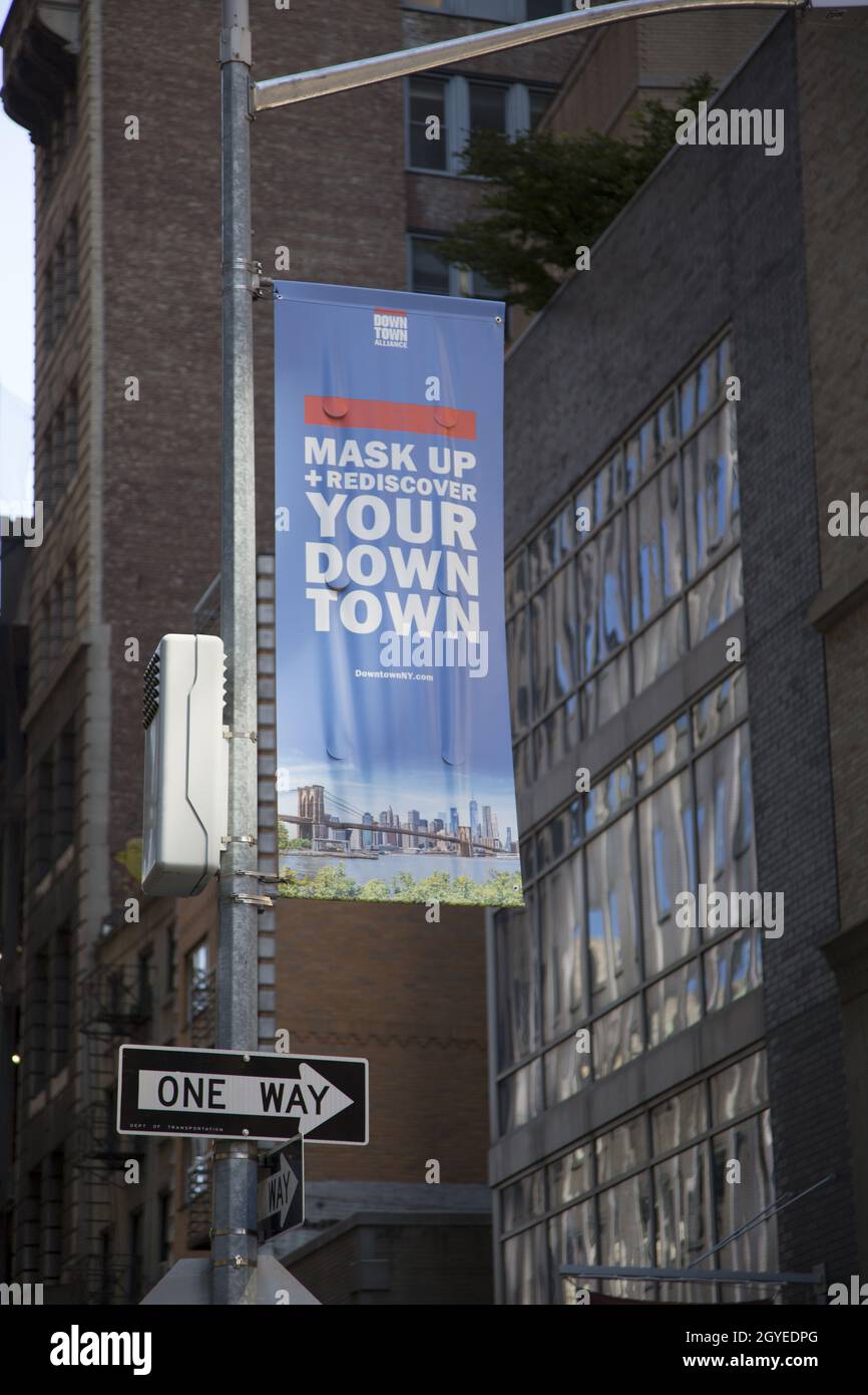 Banners hang from light posts in New York City encouraging people to ...