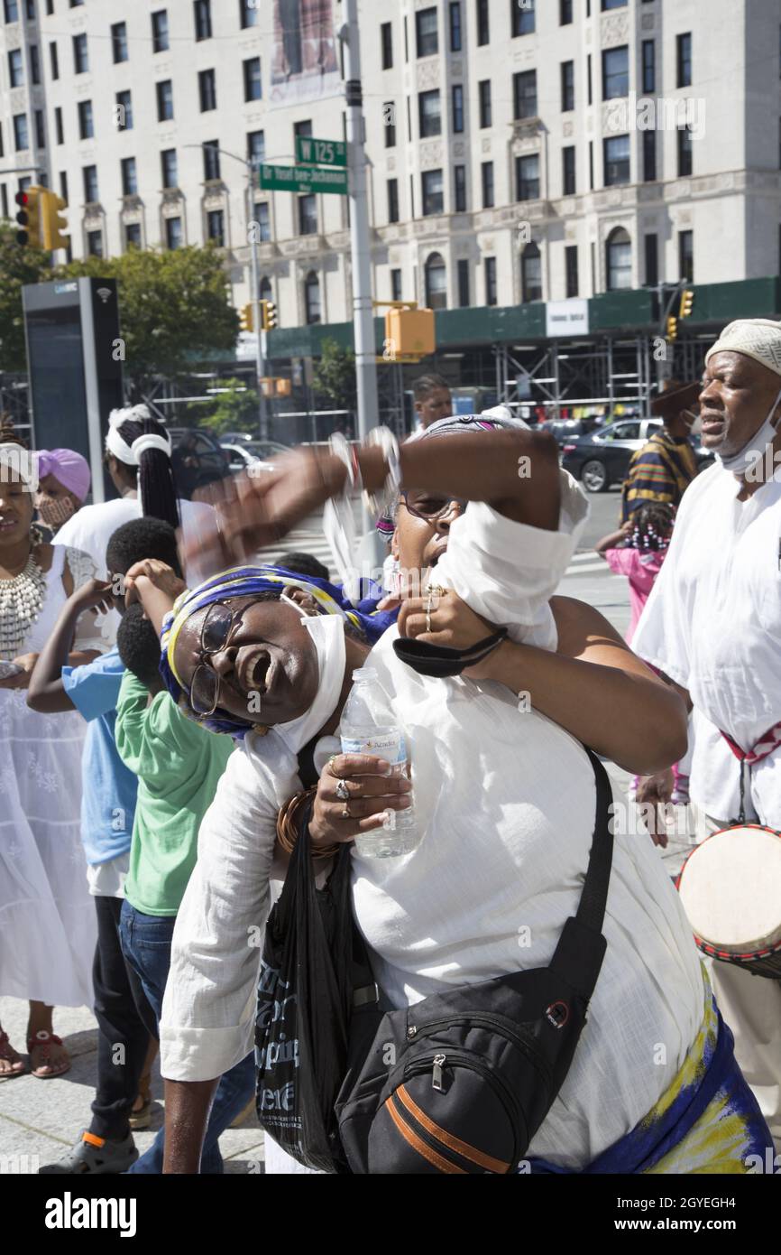 Group participates in an African Healing walk around Harlem during the ...