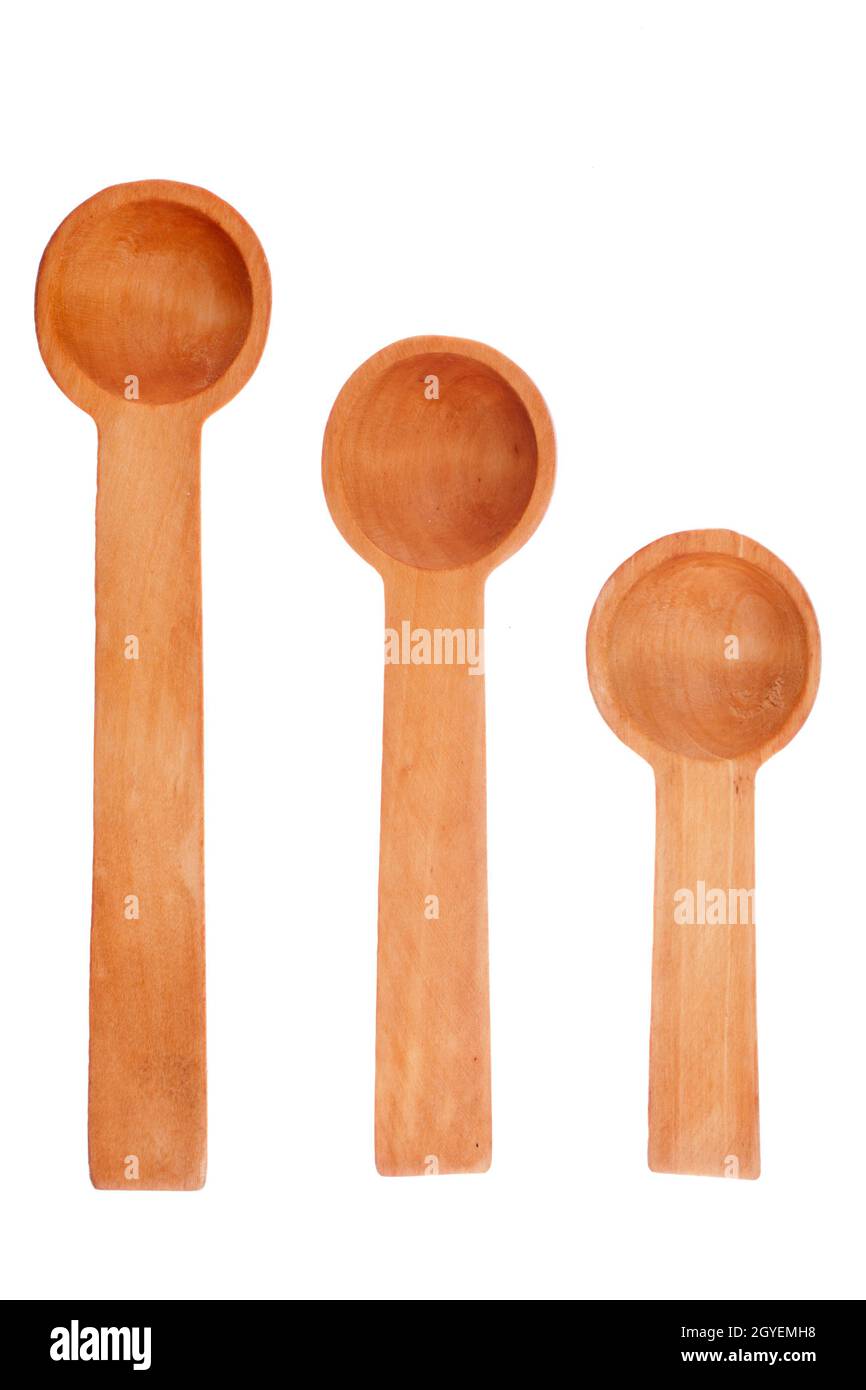 three wooden spoons isolated on white background Stock Photo - Alamy