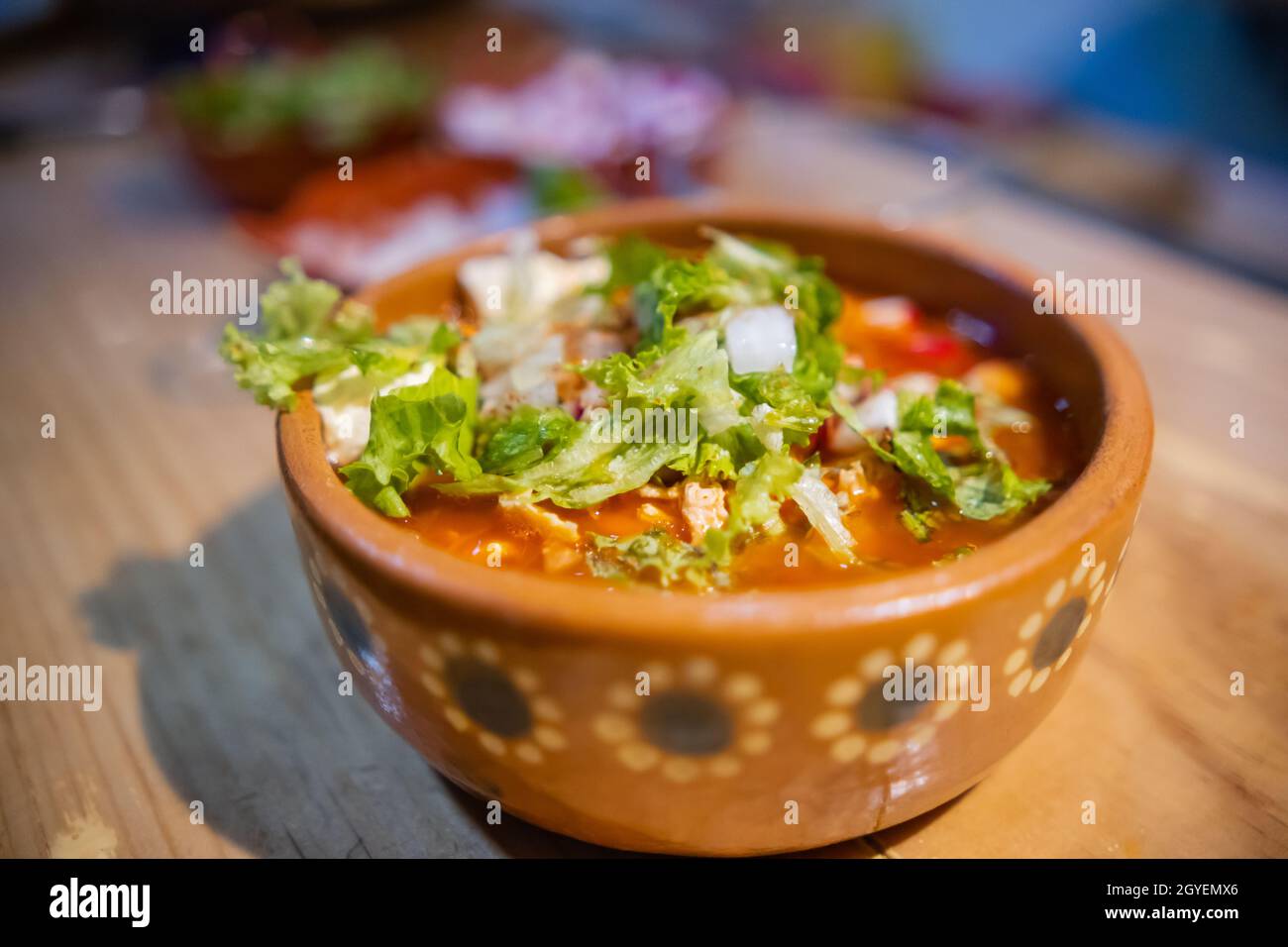 Clay bowl of delicious and traditional Mexican pozole Stock Photo - Alamy