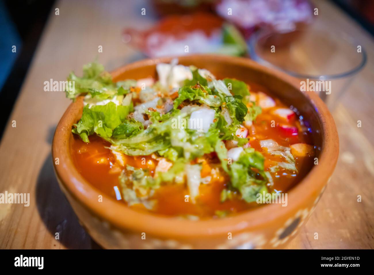 Clay bowl of condiments and delicious traditional Mexican pozole Stock ...