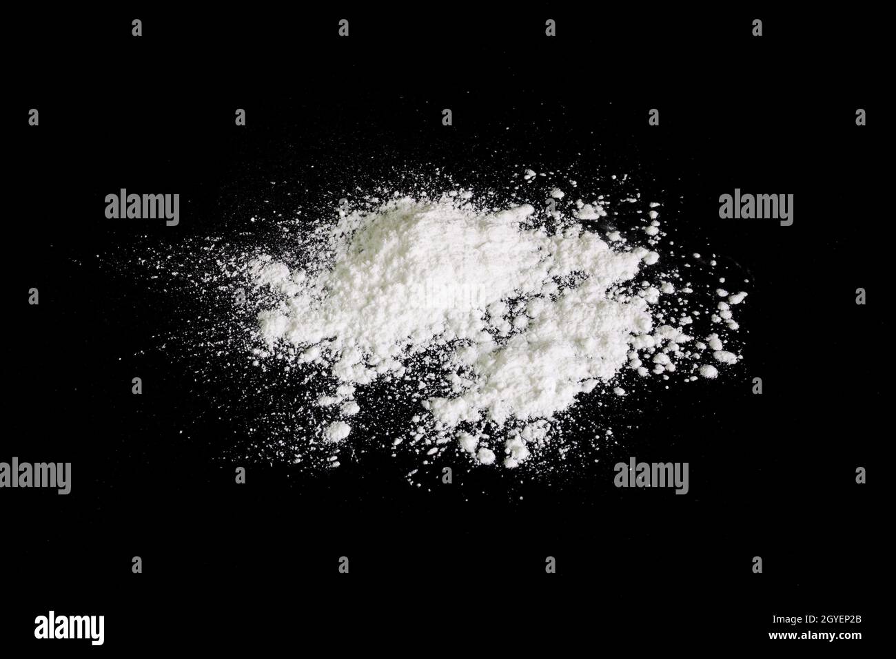 Baby talcum powder on black background Stock Photo - Alamy