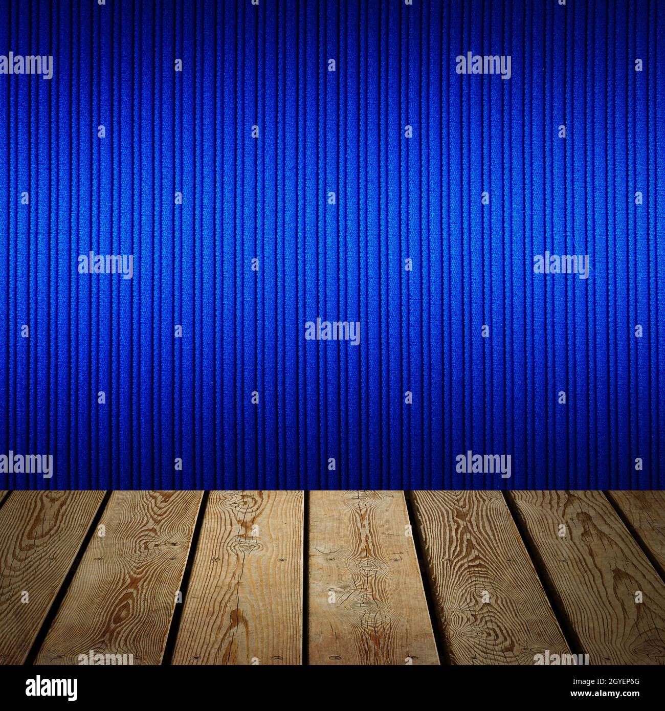 The background is blank wooden boards and a textured striped wall with ...