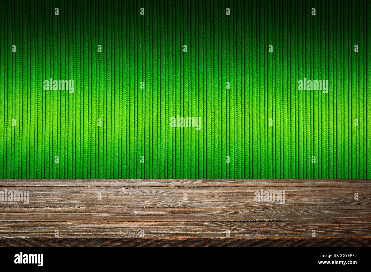 The background is blank wooden boards and a textured striped wall with ...