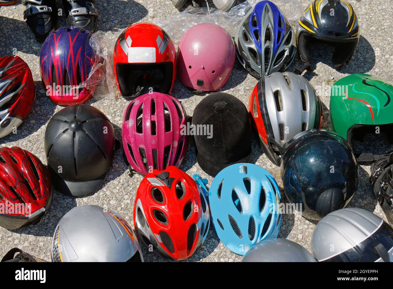 Colorful bike protective head helmets for safe cycling in a city Stock ...