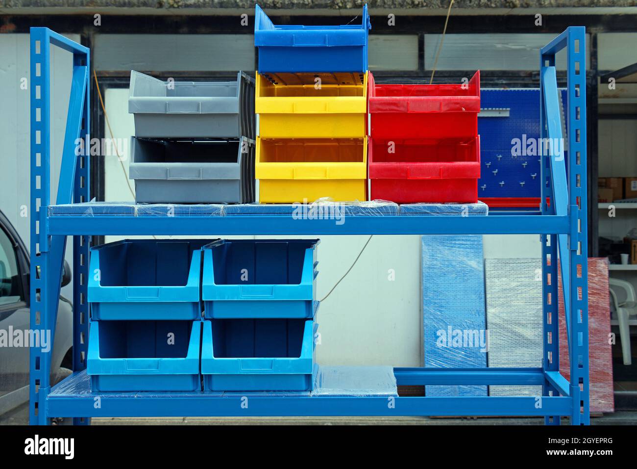 Empty plastic drawers used for storage on metal shelf Stock Photo - Alamy