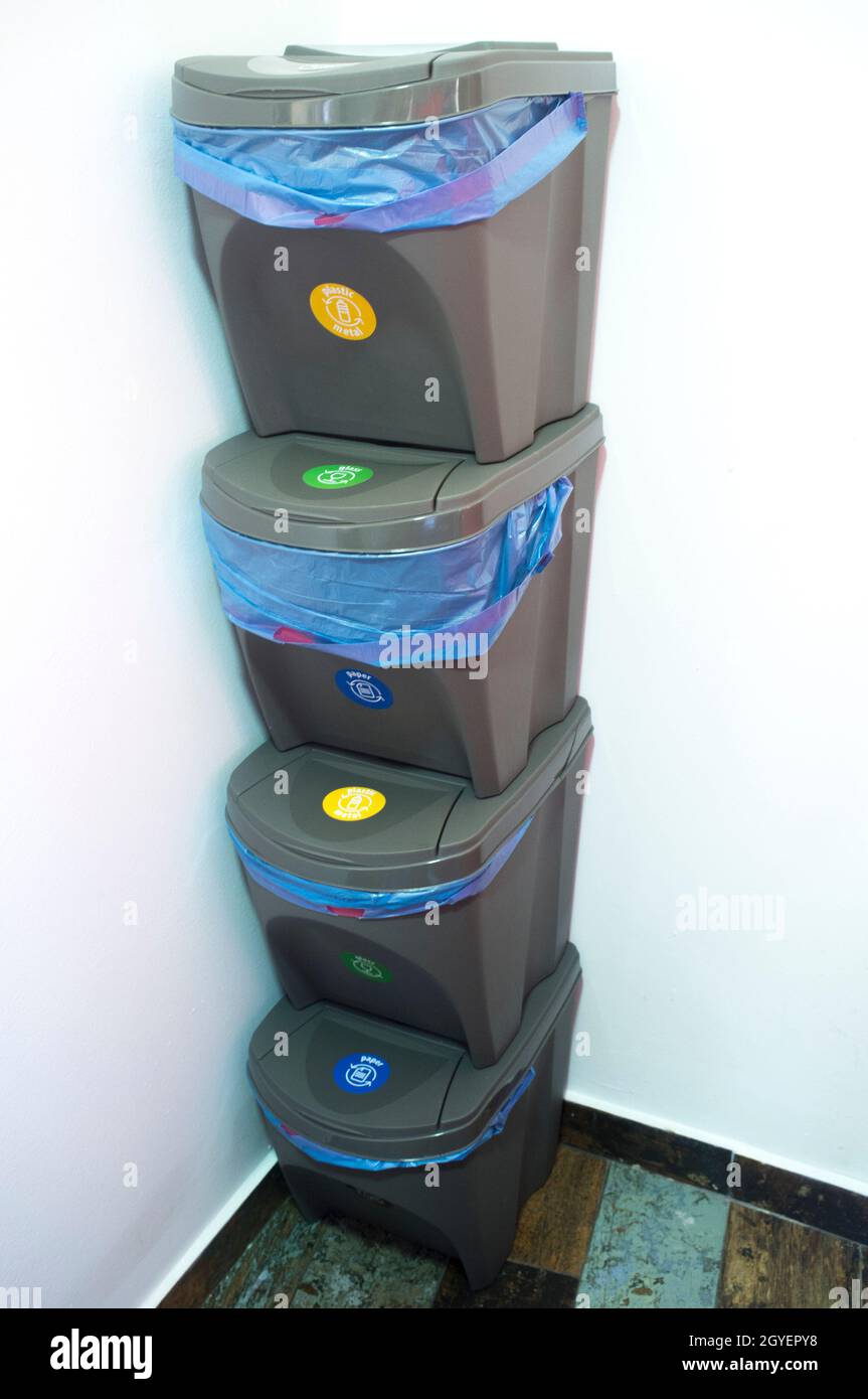 Pile of four waste stackable bins. Separating household waste concept ...
