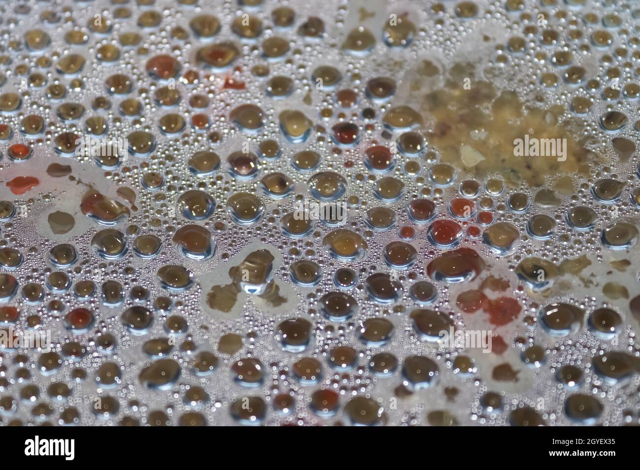 Hot water drops condensating at a glass pot cover during cooking Stock ...