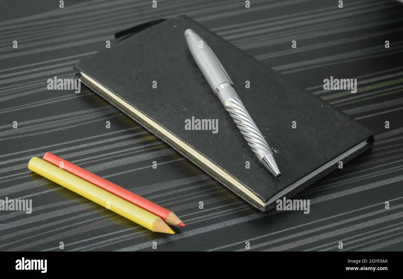 Pen and notebook on office table. Table top view. Corporate business ...