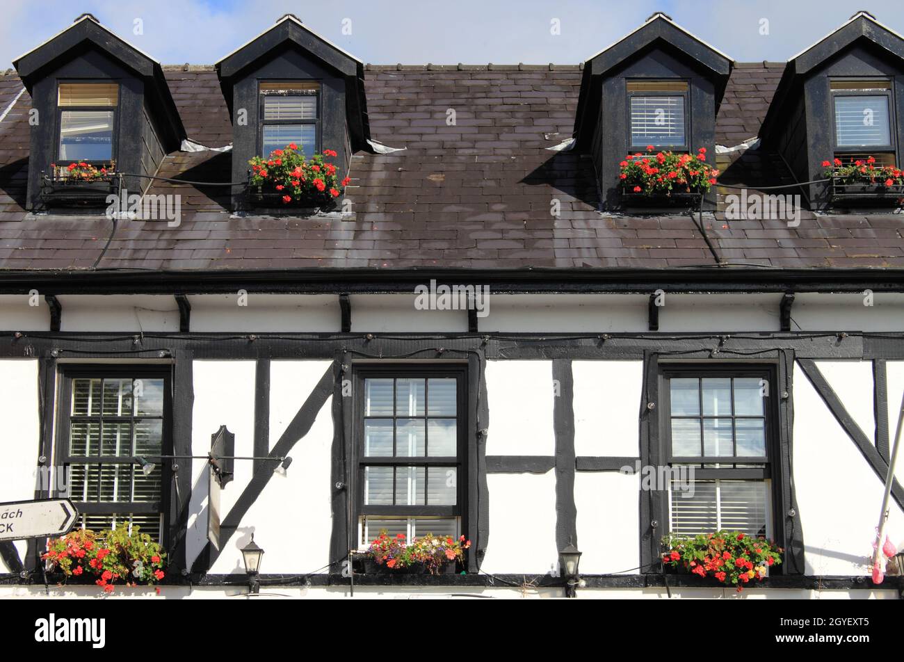 Traditional timbered house with black roof clay tiles Stock Photo - Alamy
