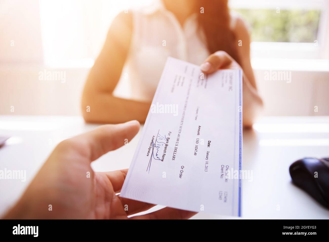 Handing Payroll Cheque To Employee. Salary Check Stock Photo - Alamy