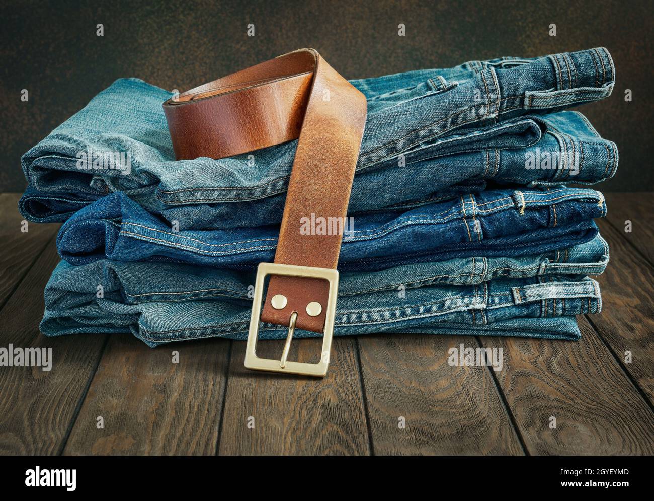 Denim pants stack on wood shelf Stock Photo - Alamy