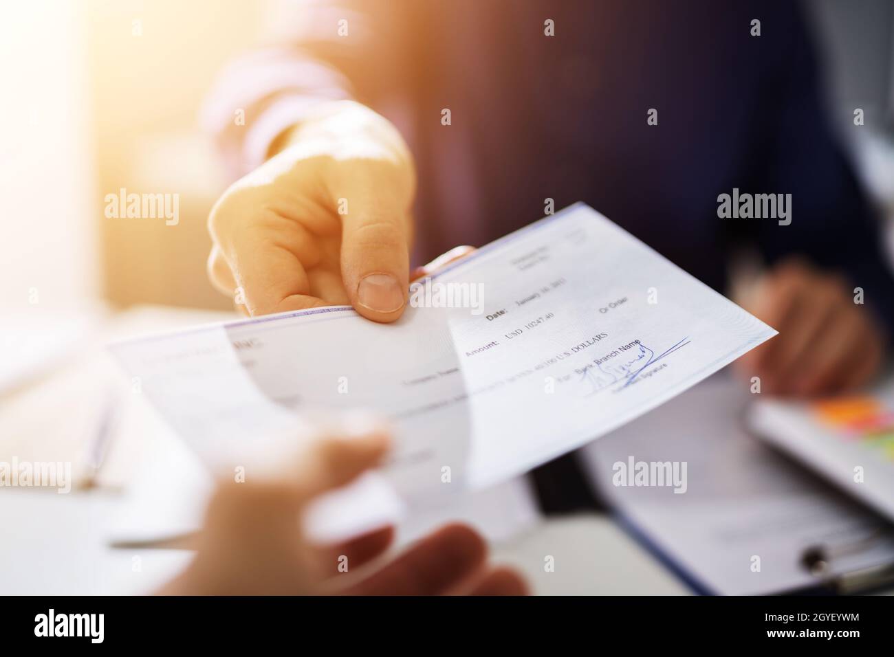 Woman giving check pay hi-res stock photography and images - Alamy