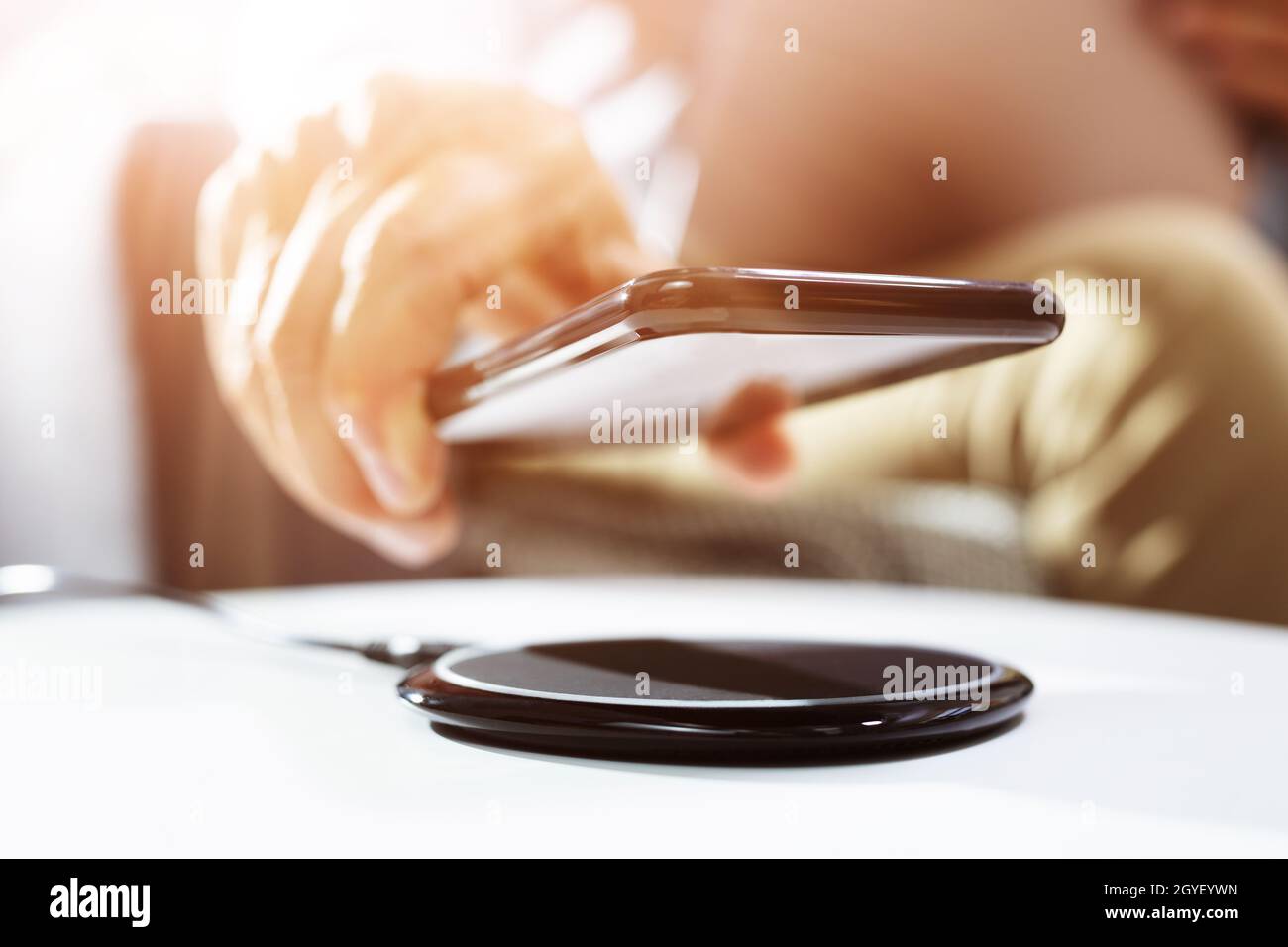 Wireless Inductive Charger. Recharge Battery Cell On Pad Stock Photo ...