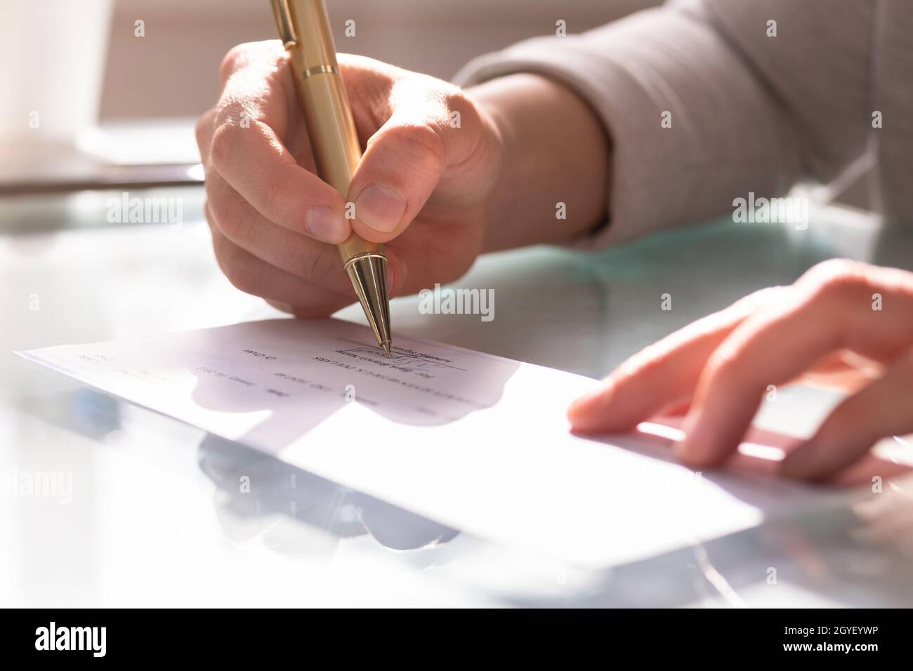 Cashier bank cheque hi-res stock photography and images - Alamy