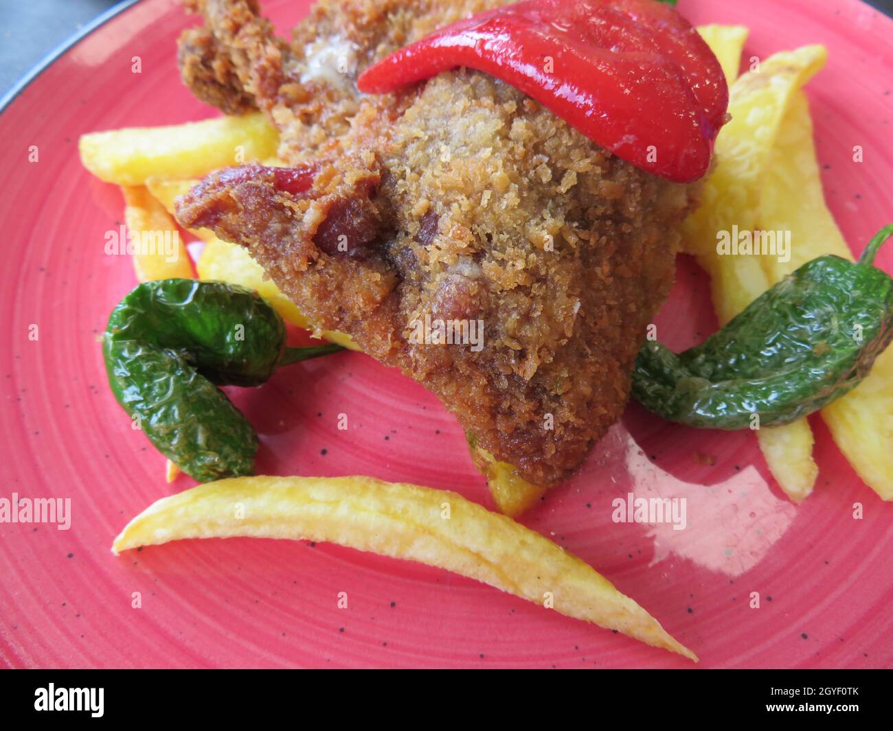 delicious breaded steak stuffed with cheese and ham Stock Photo - Alamy