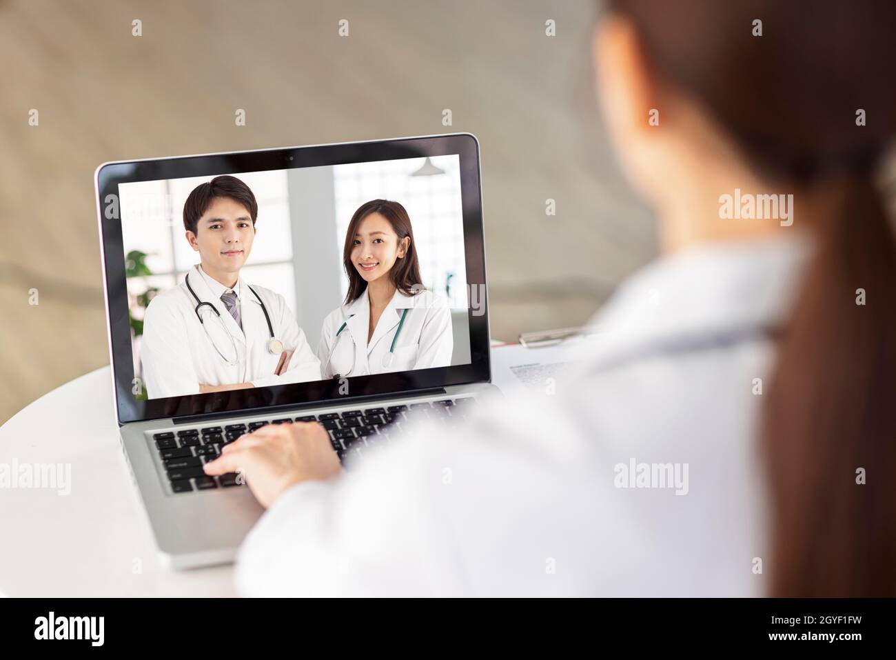 doctor making video call with her colleague Stock Photo - Alamy