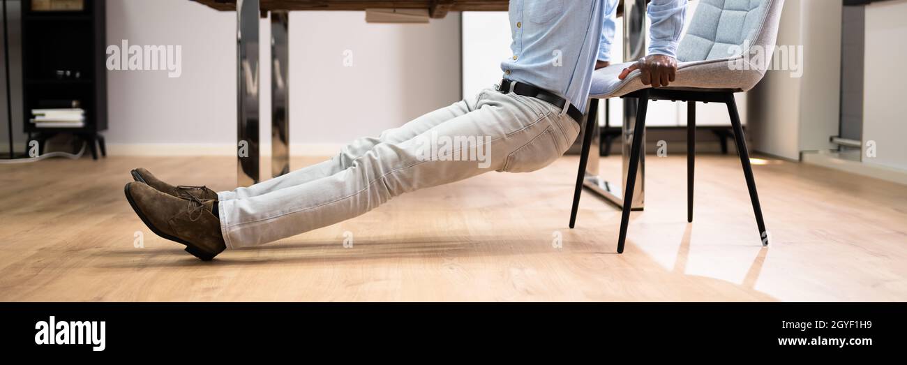 Triceps Dip Exercise Workout Using Office Chair Stock Photo - Alamy