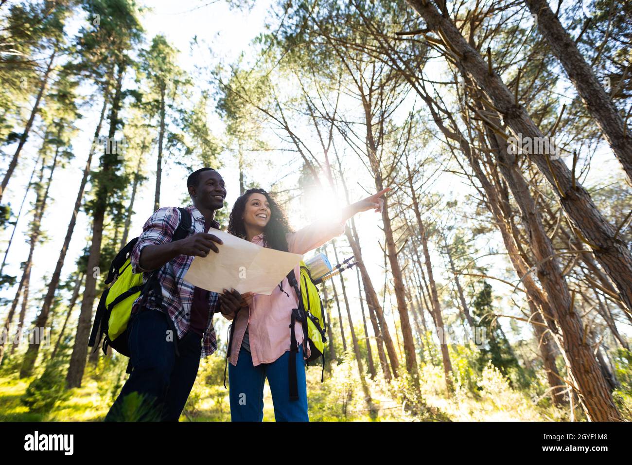 Happy diverse couple backpacks hi-res stock photography and images - Alamy