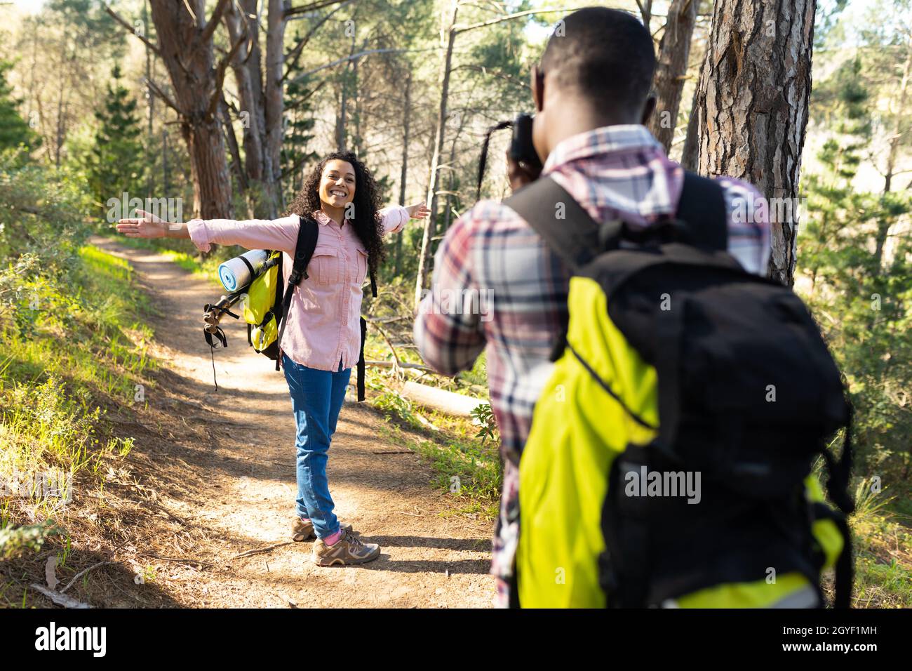 Happy diverse couple backpacks hi-res stock photography and images - Alamy