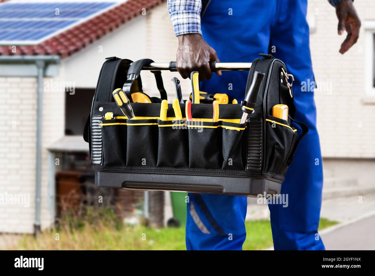 African American Handyman With Repair Box Or Toolbox Stock Photo - Alamy