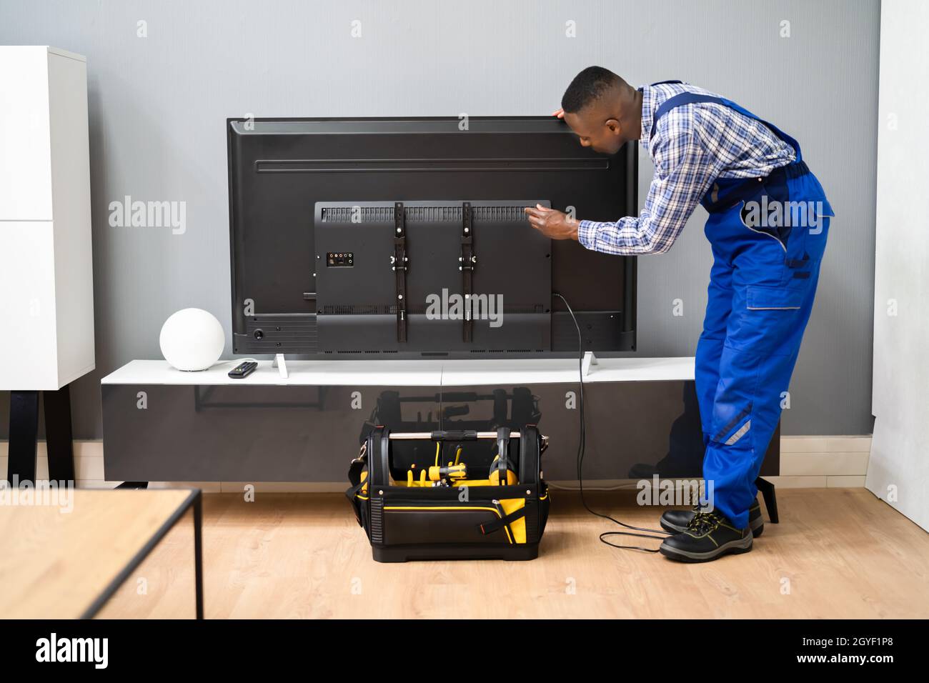 Fixing LCD Television. TV Checking And Installation Stock Photo - Alamy