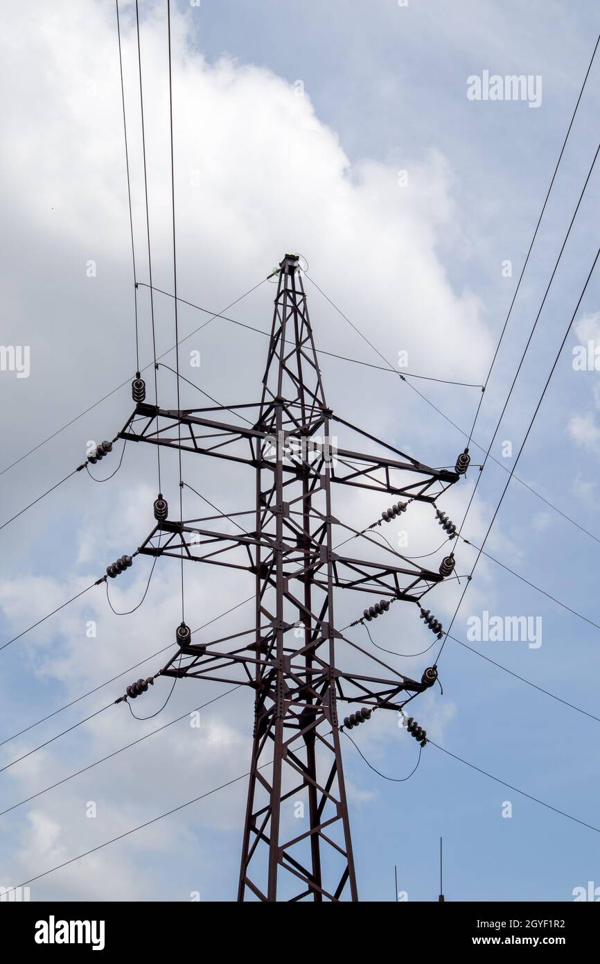 High voltage electrical tower. Power lines and power pylons on a sunny ...