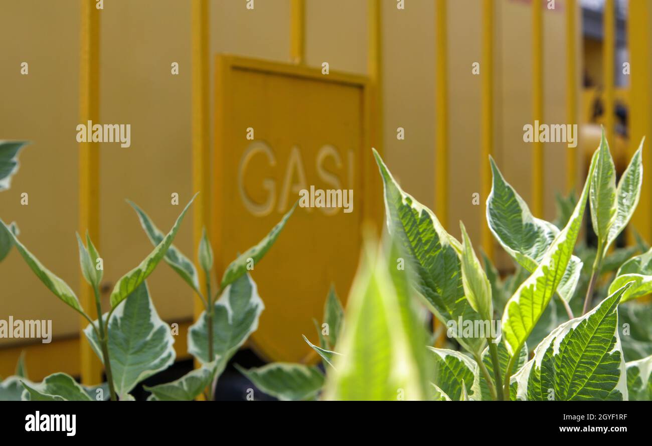 Warning on a metal cage with gas equipment for the public. Attention ...