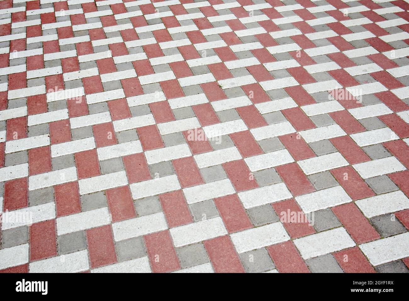 Concrete or paved newly laid gray and red paving slabs or stones for ...