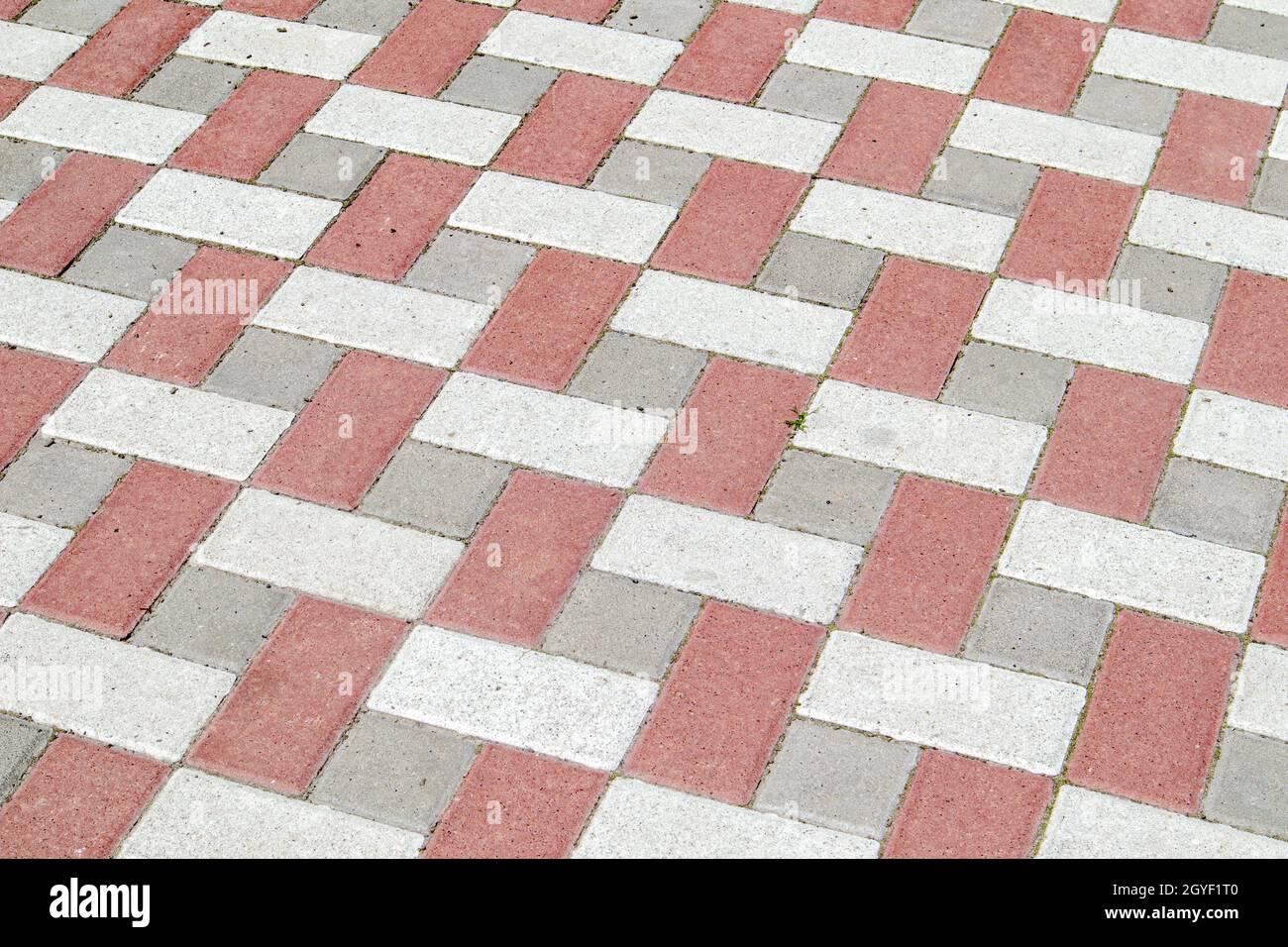 Concrete or paved newly laid gray and red paving slabs or stones for ...
