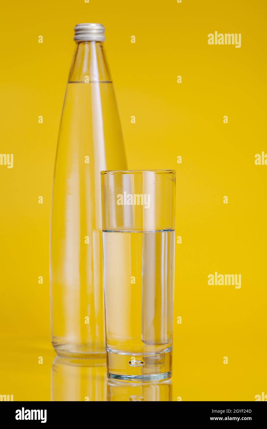 Glass of water on yellow background. Healthy lifestyle Stock Photo - Alamy
