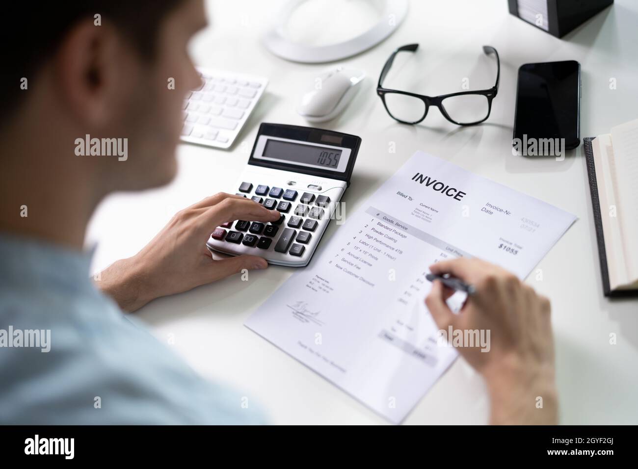 Public Account Tax Ledger And Budget Using Calculator Stock Photo - Alamy